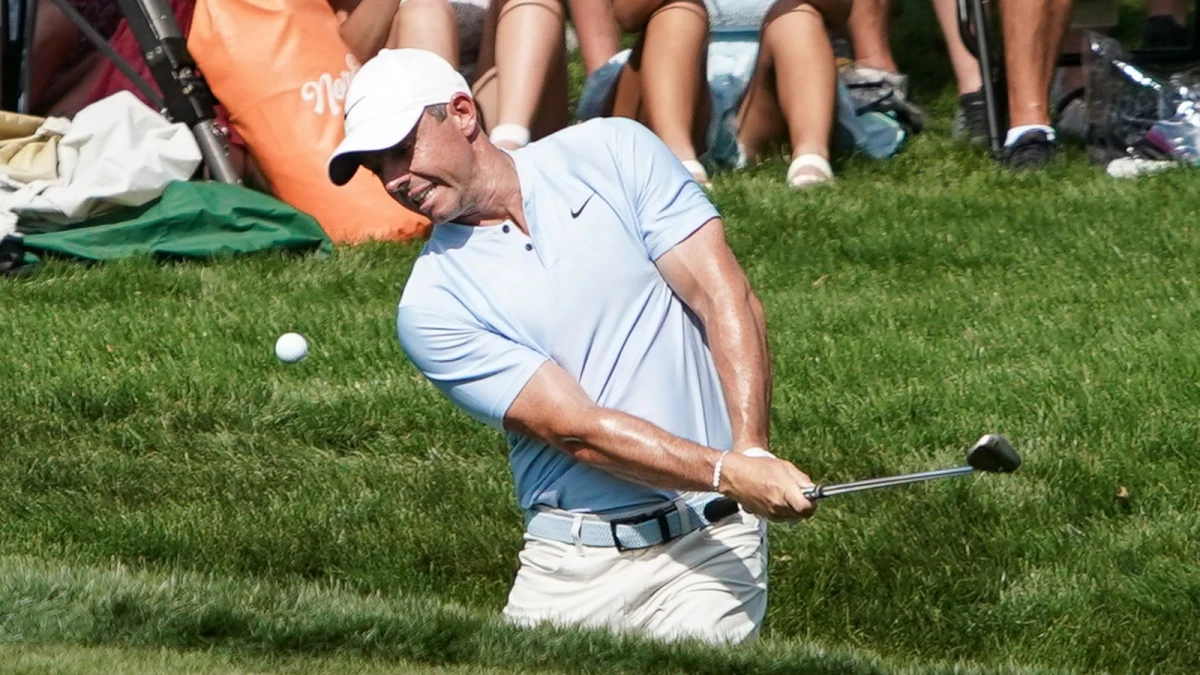 Rory McIlroy consults Tiger Woods' former coach Butch Harmon as he ...