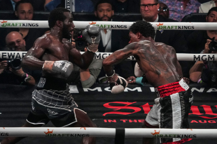 Terence Crawford makes history with TKO victory over Errol Spence Jr ...