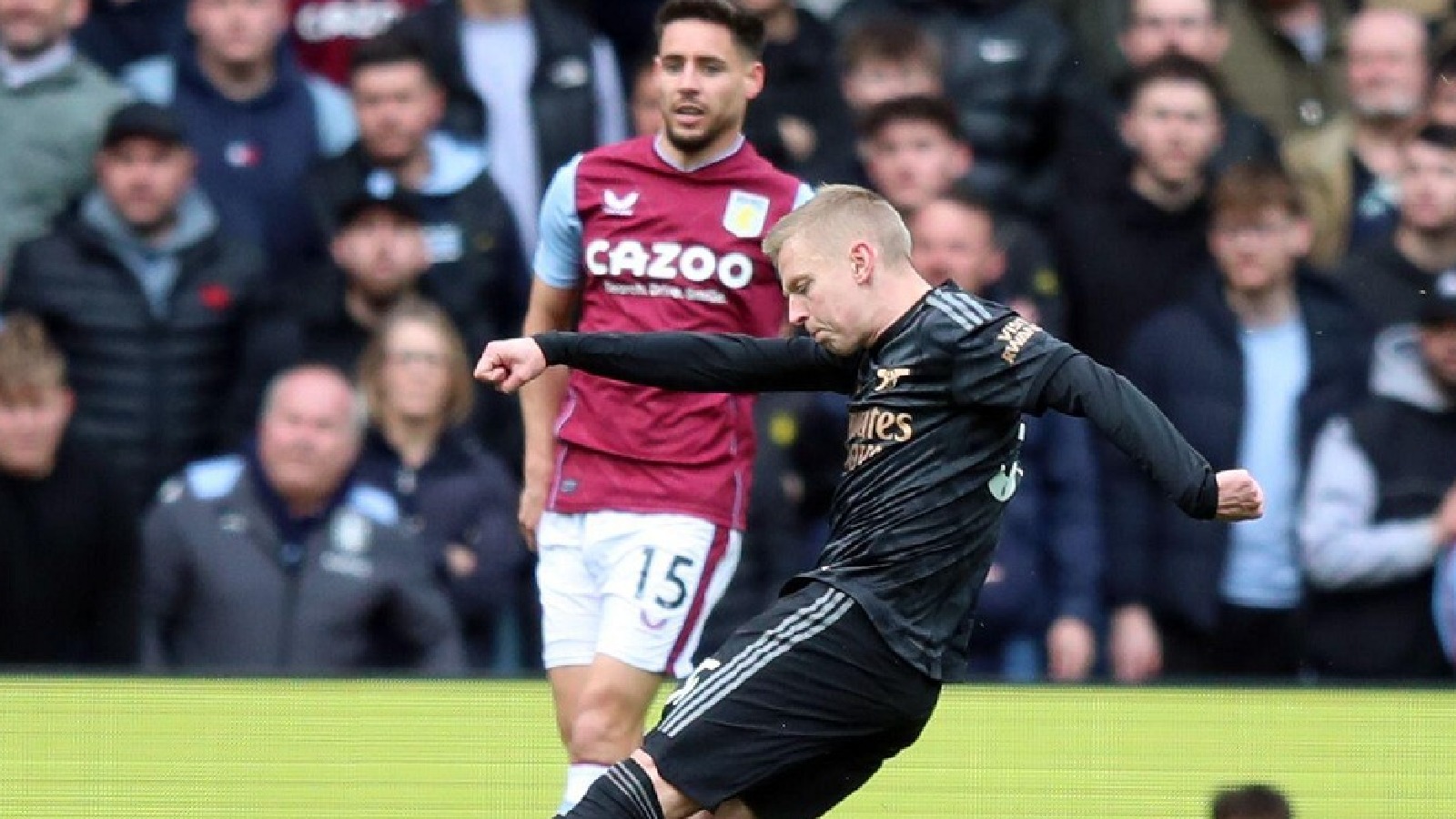 Arsenal keep title bid on track with two late goals to clinch victory ...